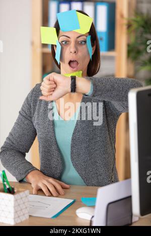 Woman with lots of reminder notes Stock Photo - Alamy
