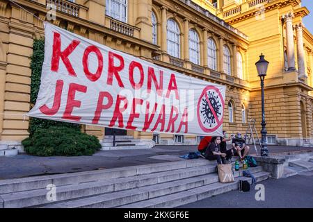Corona is freud banner is pictured in downtown Zagreb, Croatia on June ...