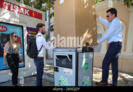Three Big Belly Solar Compactor waste and recycling bins set up on ...
