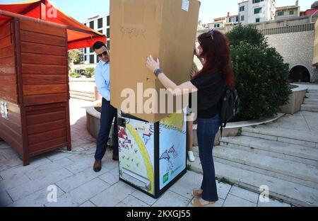 Three Big Belly Solar Compactor waste and recycling bins set up on ...