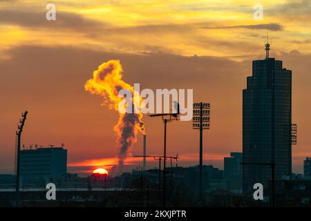 Sunrise in Zagreb, Croatia vith a view at smoke from power plant and ...