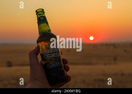Windhoek lager at sunset Stock Photo - Alamy