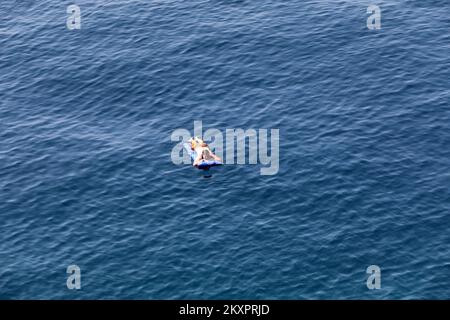 Swimmers enjoy in Sablicevo beach in Rijeka on July 24, 2021. Sablicevo ...