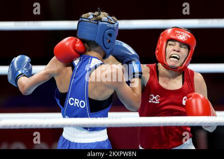 Caroline Veyre (L) of Canada exchanges punches with Nikolina Cacic (R ...