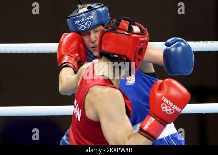 Caroline Veyre (L) of Canada exchanges punches with Nikolina Cacic (R ...