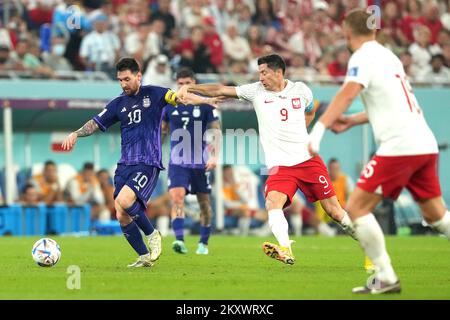 Lionel Messi of Argentina and Robert Lewandowski of Poland during the ...
