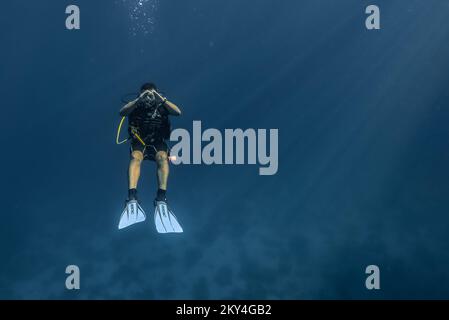 Scuba diver exploring the Gota Abu Ramada reef on September 30, 2022 in ...