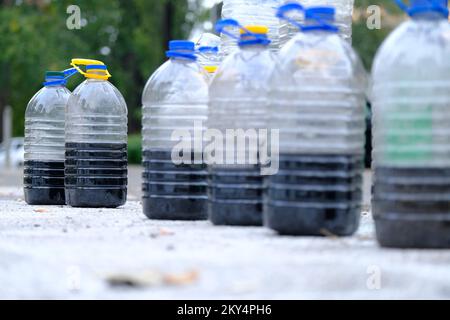 Big chess board of chalk with chess pieces made of plastic bottles seen ...