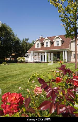 Landscaped backyard with modern style two storied Canadiana home in ...