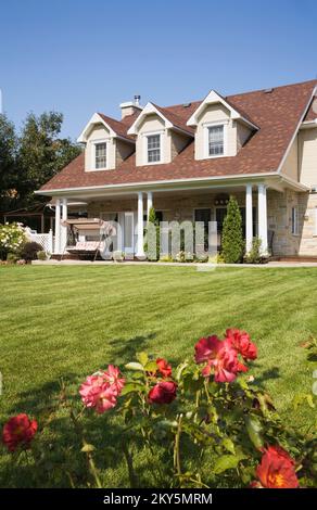 Landscaped backyard with modern style two storied Canadiana home in ...