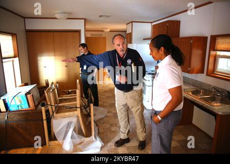 FEMA Logistics Supervisor Mark Ackerman (C) explains to Deputy Regional ...