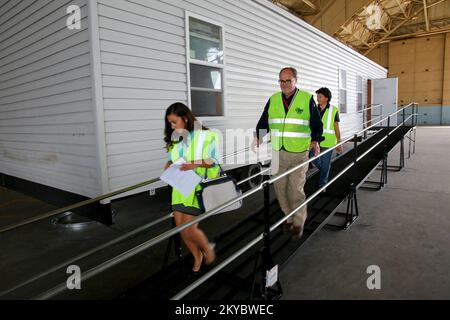 FEMA Logistics Supervisor Mark Ackerman (C) explains to Deputy Regional ...