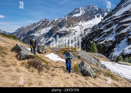 Ski tourers hiking in spring with little snow, Neustift im Stubai ...