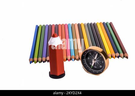 Colour pencil with compass and pen on white background Stock Photo - Alamy
