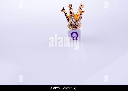 Crown on letter cube on a white background Stock Photo - Alamy