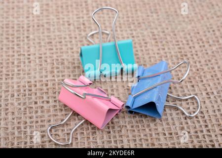 Colorful clip placed on a linen canvas Stock Photo - Alamy