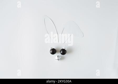 Minimalistic New year composition. Bunny face made from paper ears ...