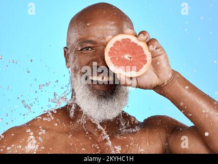 Grapefruit, portrait and senior black man in studio with water splash for bathroom product ...