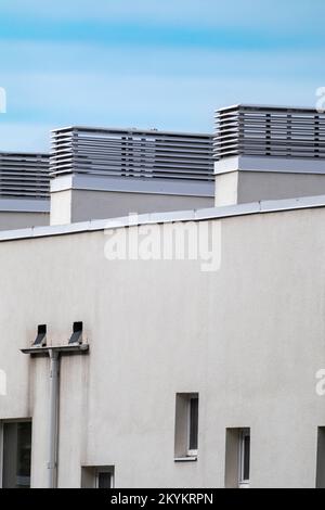 House outdoor roof ventilation units on sunny day on sky background ...