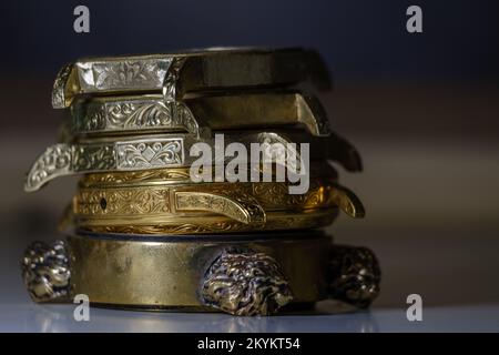 Close-up, golden blank for production of pocket watches, sketch and ...