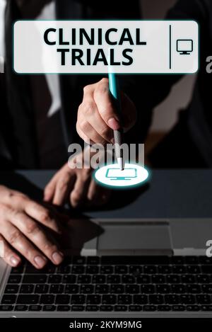Hand writing sign Clinical Trials. Business concept Research ...