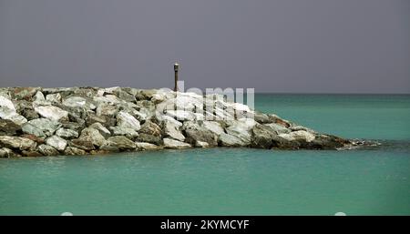 A breakwater from the embankment of huge stones to protect the beach ...