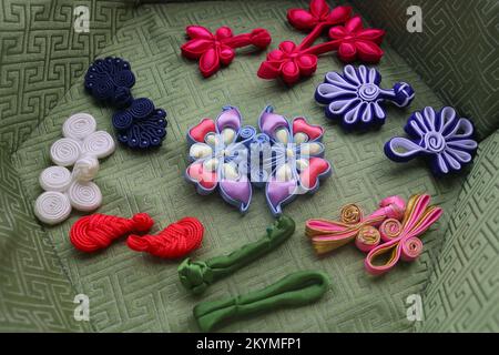 Mandarin button in Chinese filigree fabric surface Stock Photo - Alamy