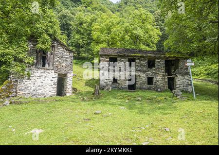 Ruined stone houses and mills in an abandoned mountain village in the ...