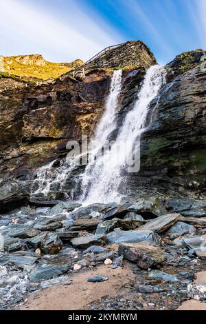 Waterfall on the River Trerammet dropping on to the beach at Tintagel ...