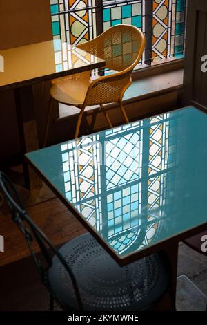 Stained glass windows let light into a cafe at Mercato Mayfair in ...
