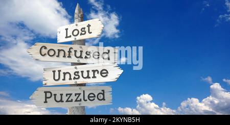 Lost, confused, unsure, puzzled - wooden signpost with four arrows ...