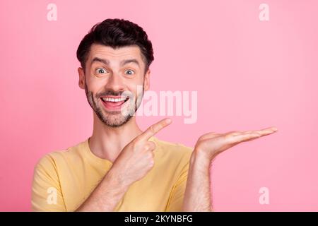 Photo of handsome impressed guy dressed xmas green cardigan bowtie ...
