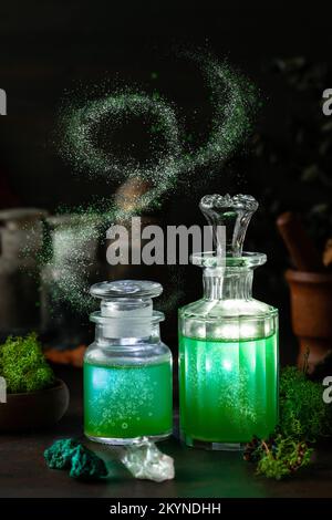 Witchcraft still life concept with smoking potion, herbs ingredients ...