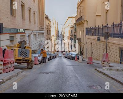Valletta, Malta - May, 2021: Narrow streets and historic sand-colored ...