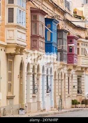 Sliema, Malta - May, 2021: Narrow street and historic sand-colored ...