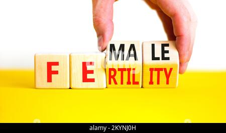 Female fertility symbol. Concept word Female fertility on wooden cubes ...