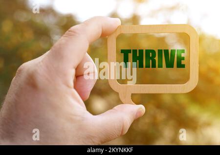 Ecology concept. A man holds a sign inside which the inscription - ECO ...