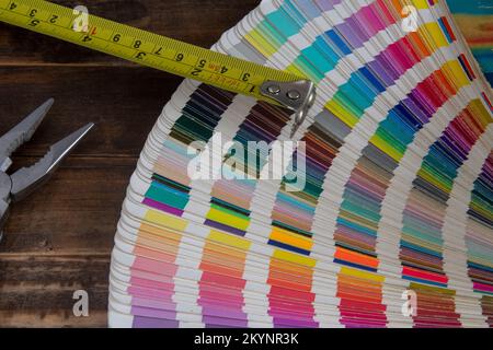 Sampler of colors used in graphic arts, on a wooden table Stock Photo ...
