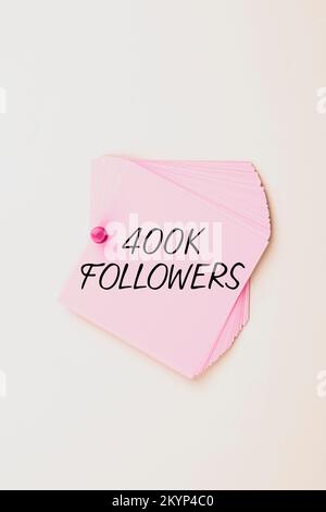 Sign displaying 400K Followers, Word Written on number of individuals ...