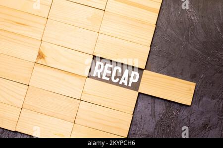 Recap word from wooden blocks on desk Stock Photo - Alamy
