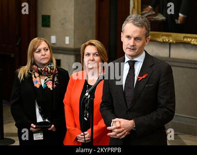 Bea Bruske, President of the Canadian Labour Congress, centre, speaks ...