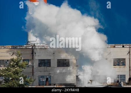 Emission of caustic toxic steam smoke at the plant pipe industry and ...