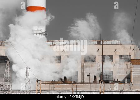 Emission of caustic toxic steam smoke at the plant pipe industry and ...
