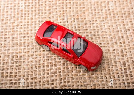 Colorful little toy car on canvas background Stock Photo - Alamy
