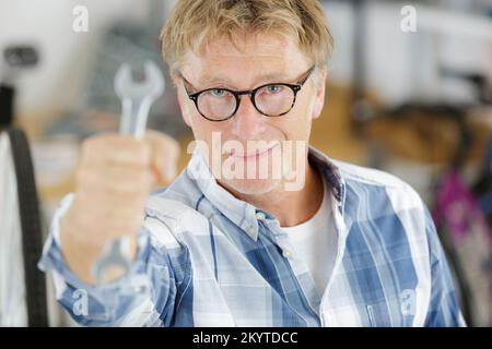plumber showing pipes at the camera Stock Photo - Alamy