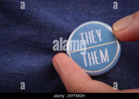 A person showing their They Them pronouns by wearing a badge Stock ...