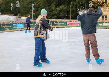 Harrogate, UK. 2nd December, 2022.A snowball fight breaks out between a ...