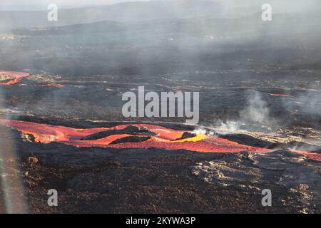 Lava flowing from Mauna Loa eruption towards Saddle Road. Elements of ...