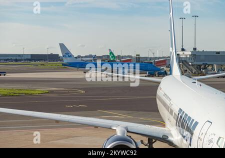 A picture of multiple planes in the Schiphol Airport Stock Photo - Alamy