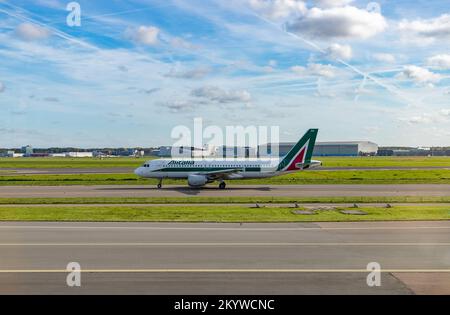A picture of an Airbus A320 Alitalia plane on the runway Stock Photo ...